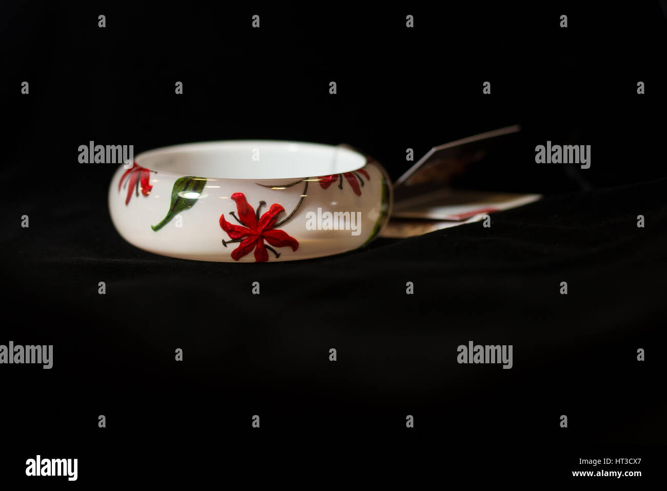 Ethnic bracelet hand plastic black background Stock Photo - Alamy