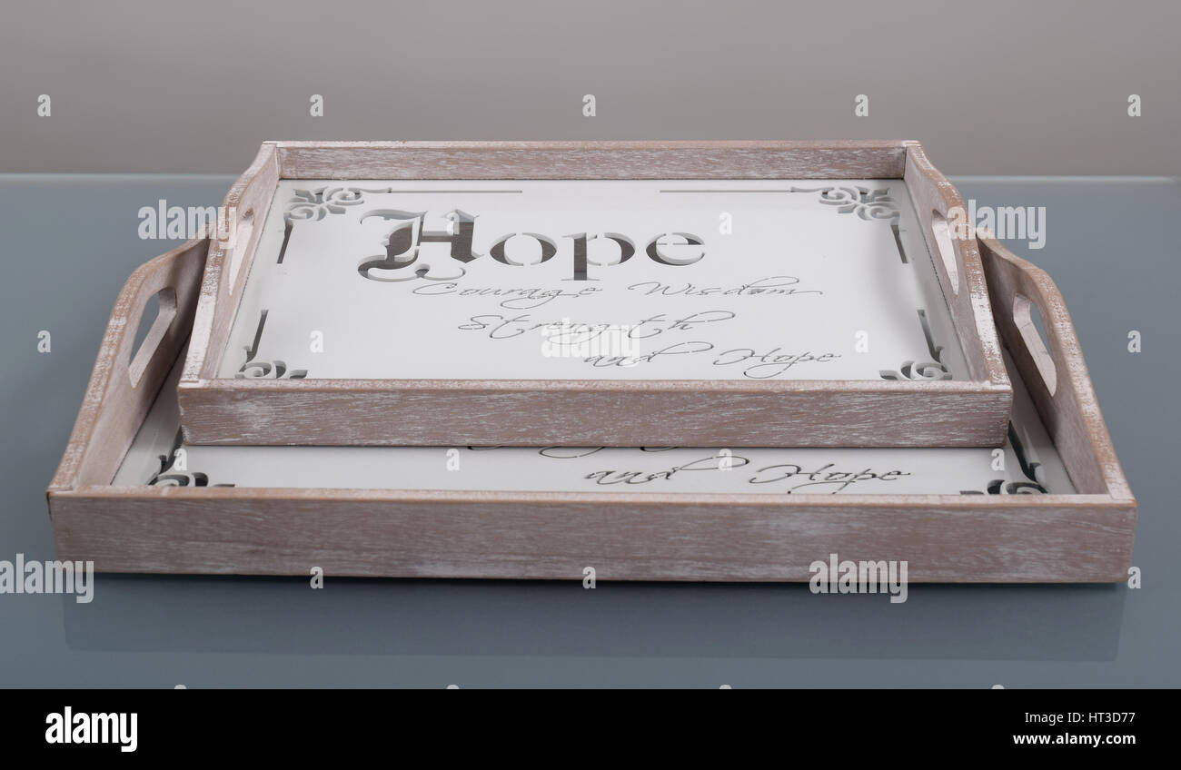 Empty wooden trays with carved text and decoration for serving food or ...