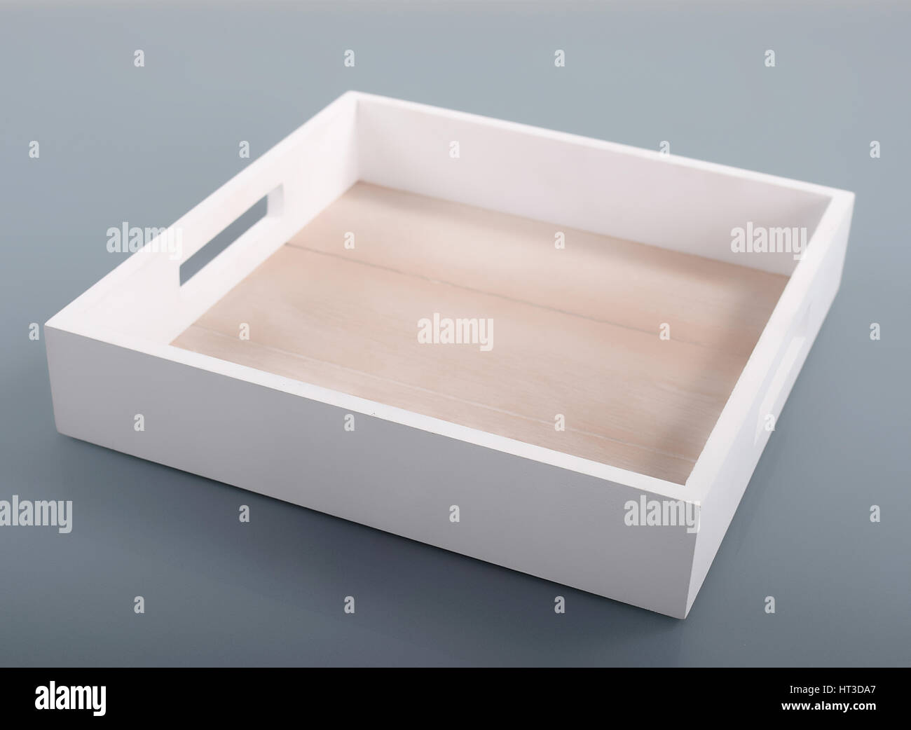 White wooden tray on gray background Stock Photo - Alamy
