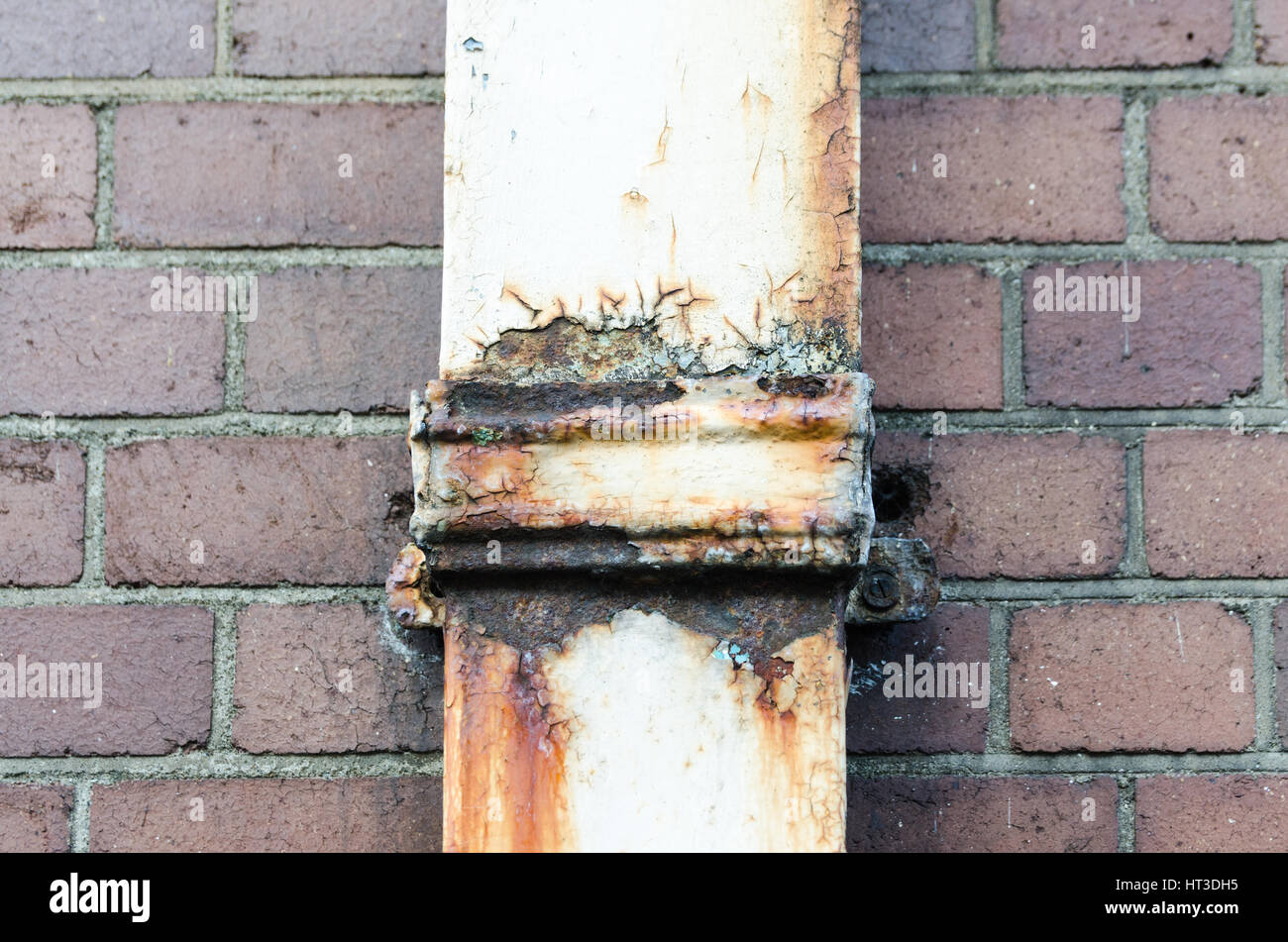 Rusted joint of square white down drain pipe Stock Photo - Alamy