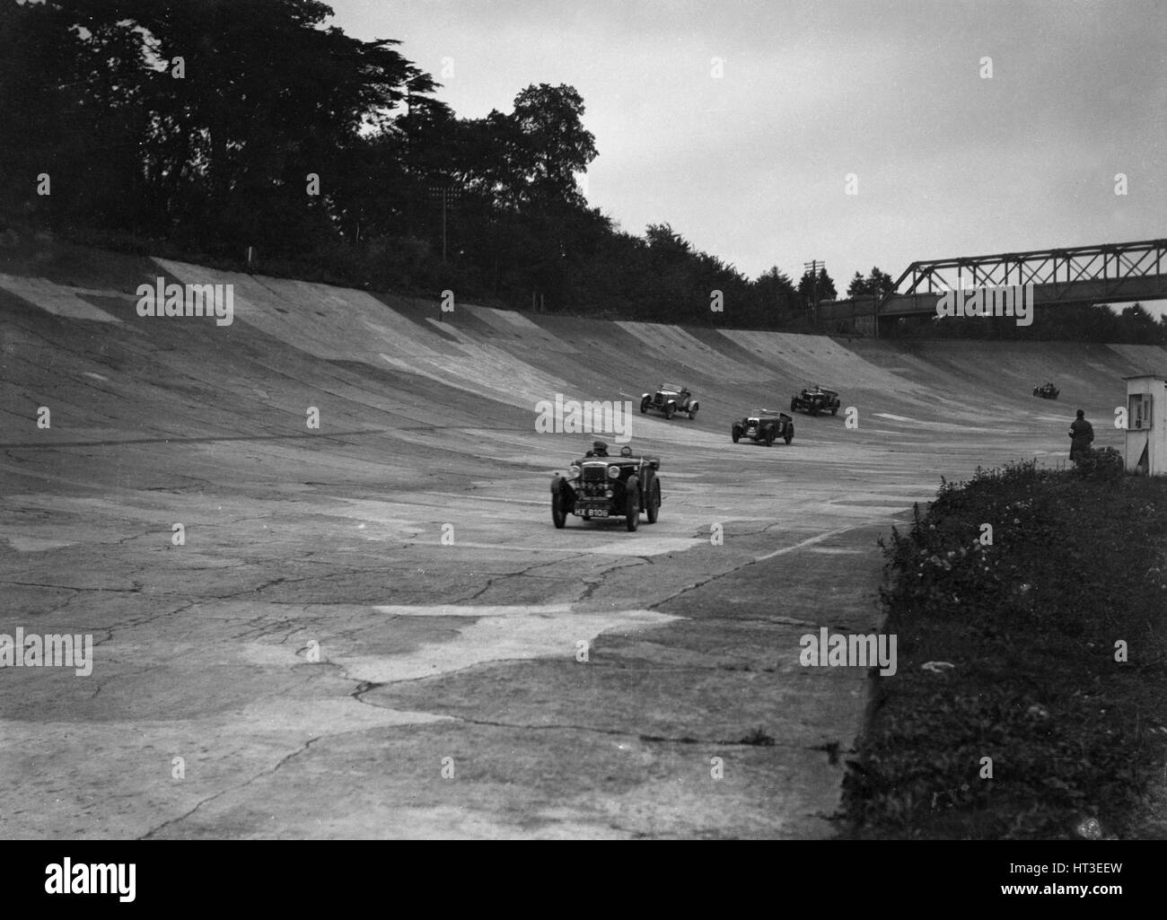 Cars racing on banking Black and White Stock Photos & Images - Alamy