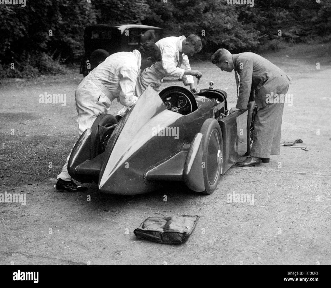 Mechanics working on Leon Cushman's Austin 7 racer for a speed record ...