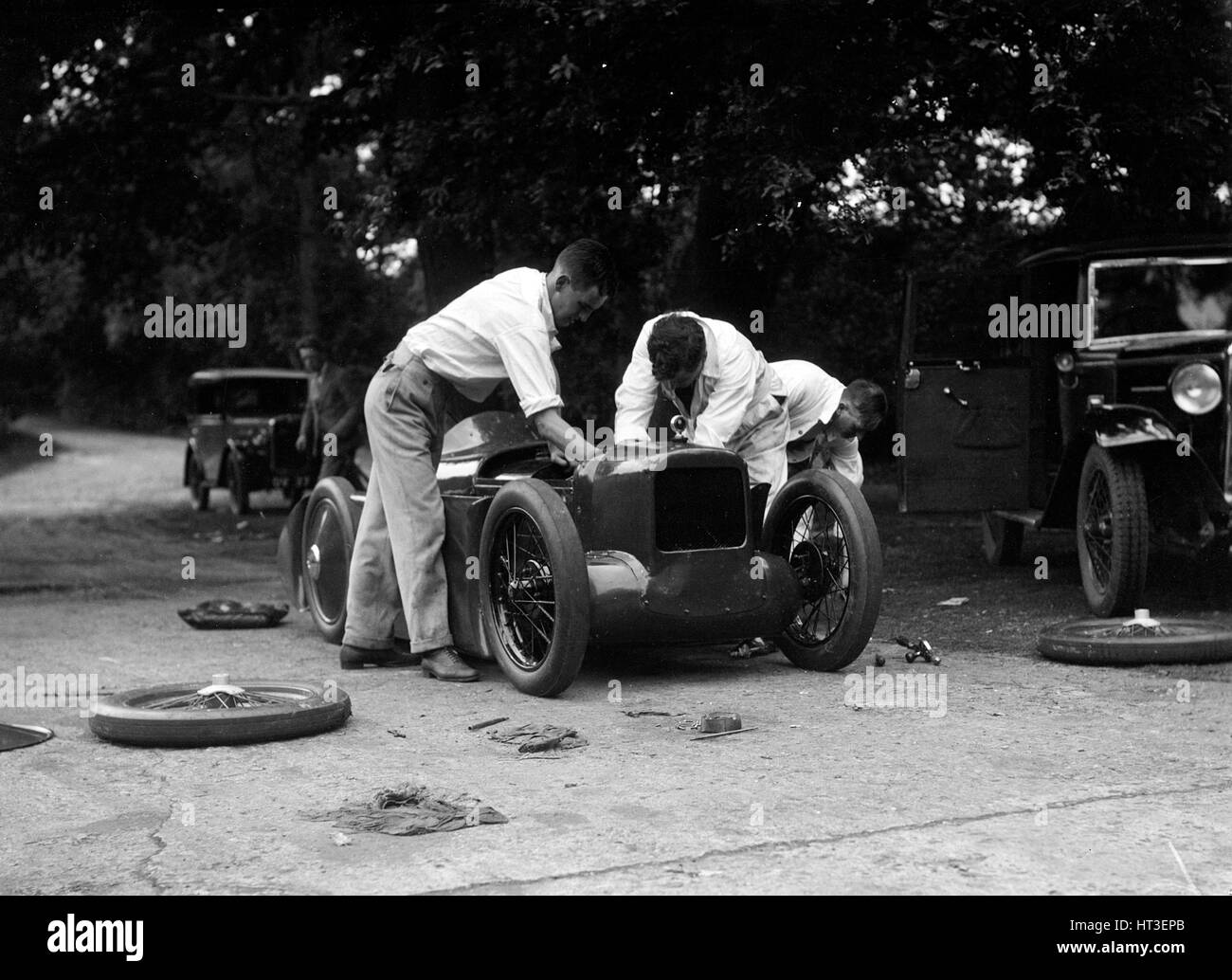 Mechanics working on Leon Cushman's Austin 7 racer for a speed record ...
