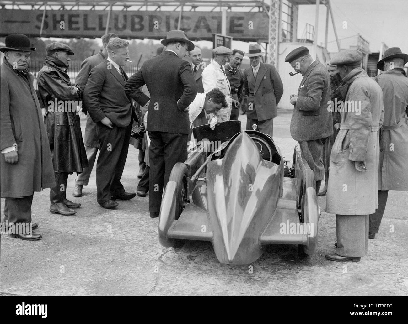 People examining Leon Cushman's Austin 7 racer at Brooklands for a ...