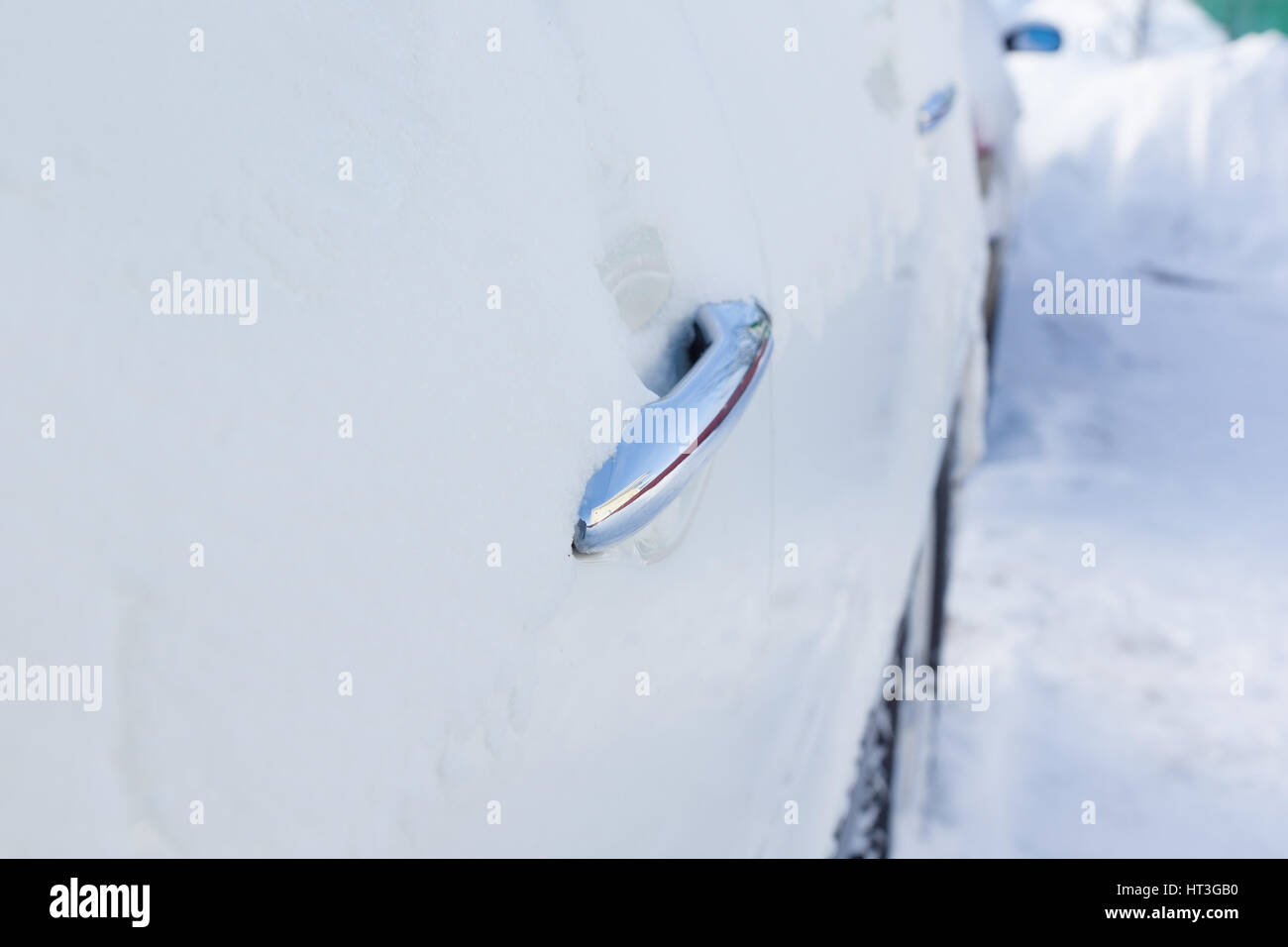 White car covered with snow during a blizzard Stock Photo - Alamy