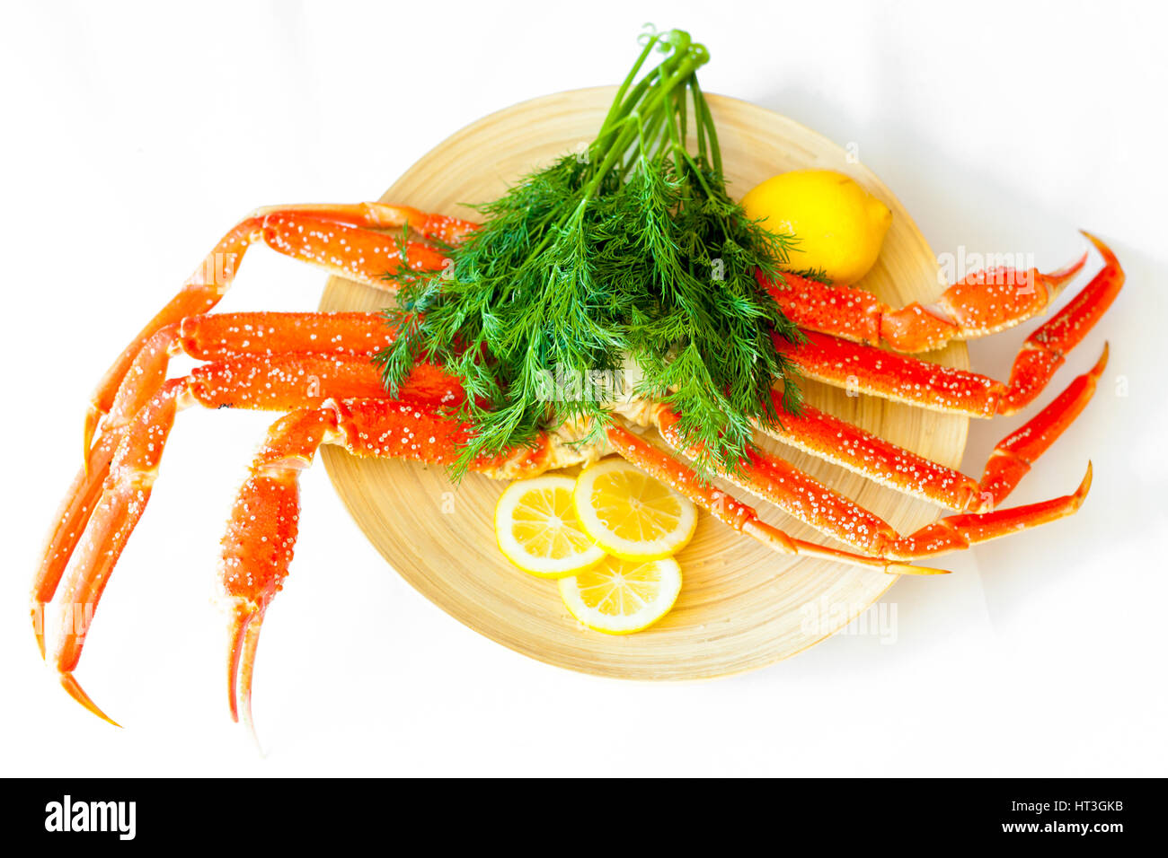 crab legs with lemon on a plate. Steamed crab Stock Photo - Alamy
