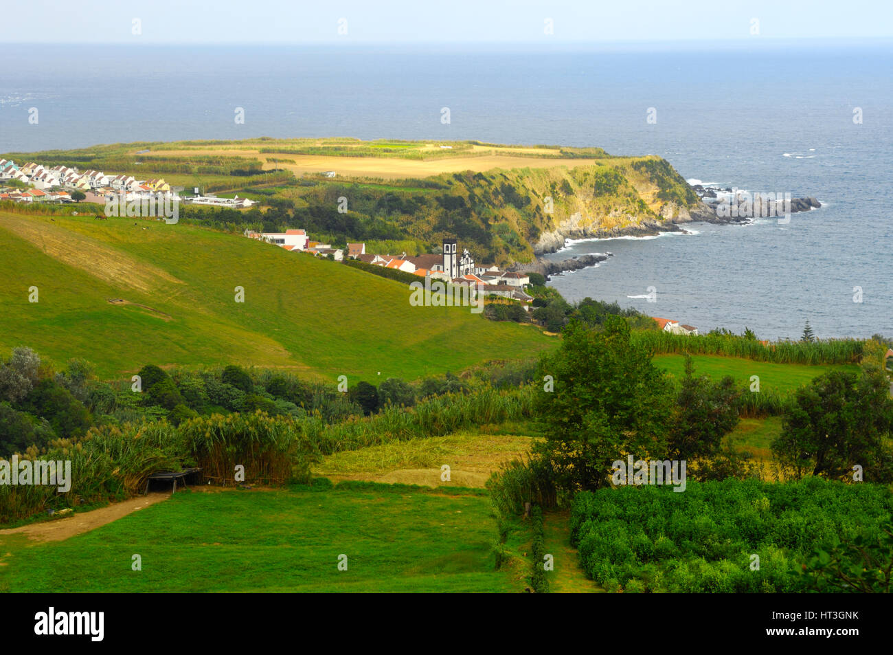 Looking across Sao Miguel, Azores, farmland and fields toward coastal ...