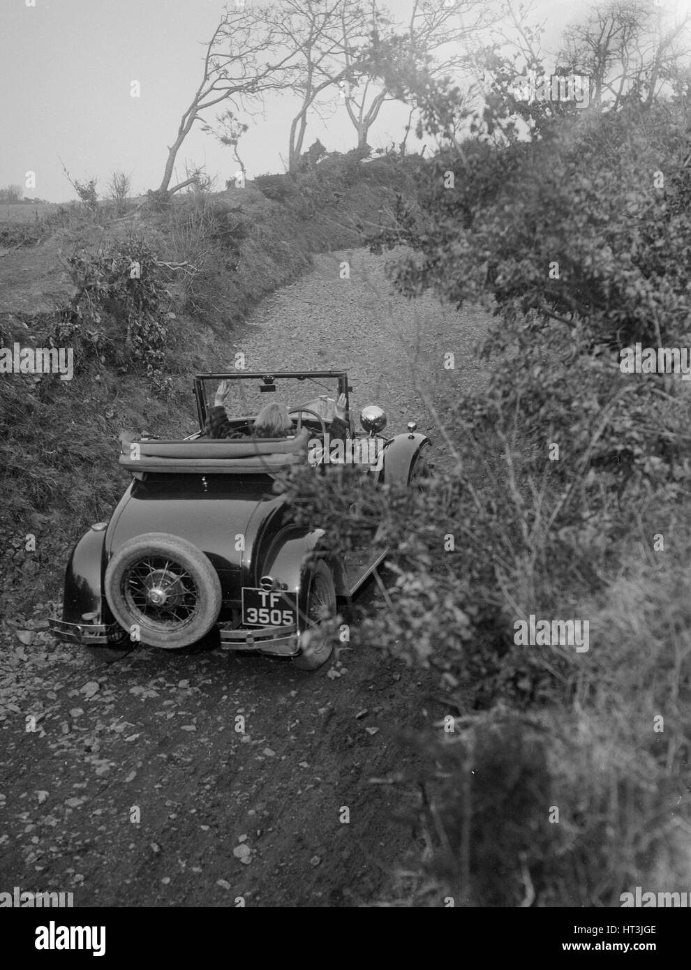 Kitty Brunell driving a 1930 2-seater Ford Model A, 1931. Artist: Bill ...