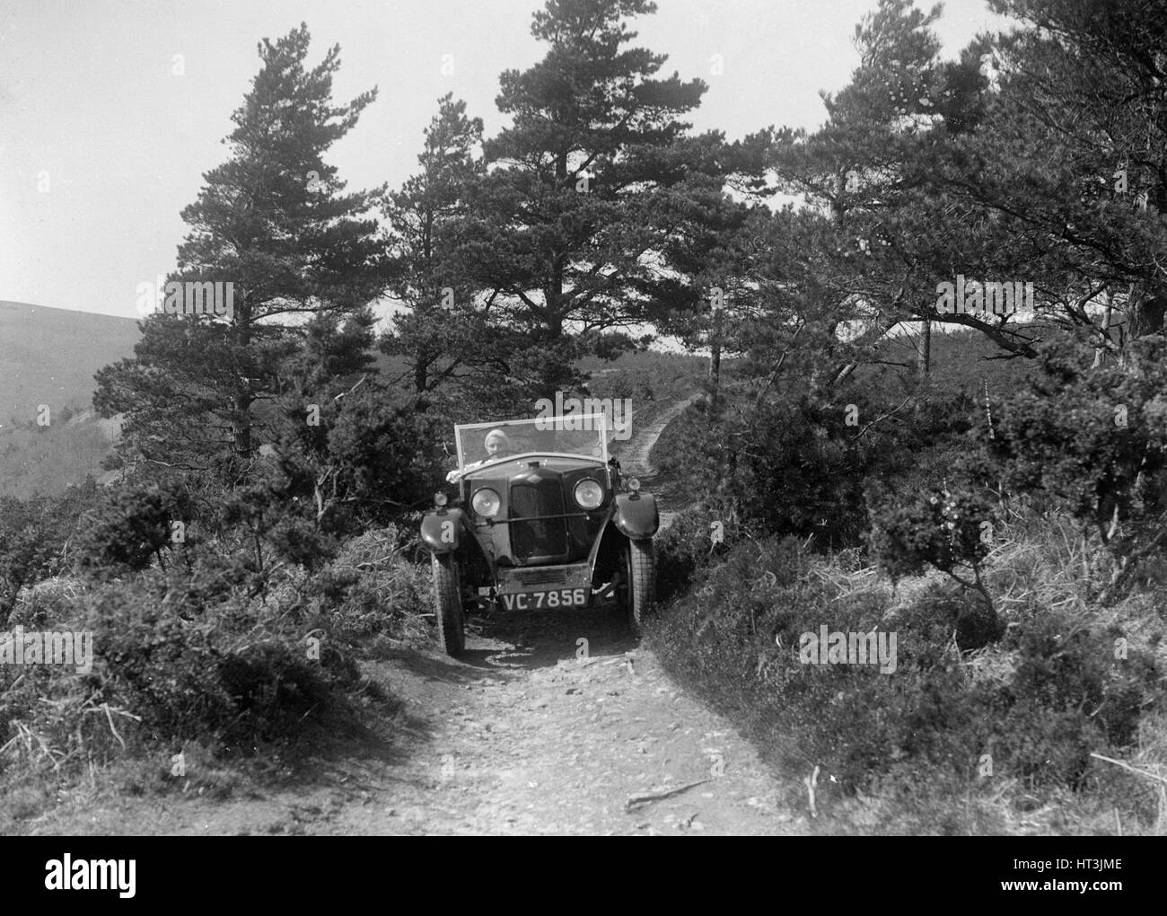Kitty Brunell road testing a Riley 9 WD tourer, c1930. Artist: Bill ...