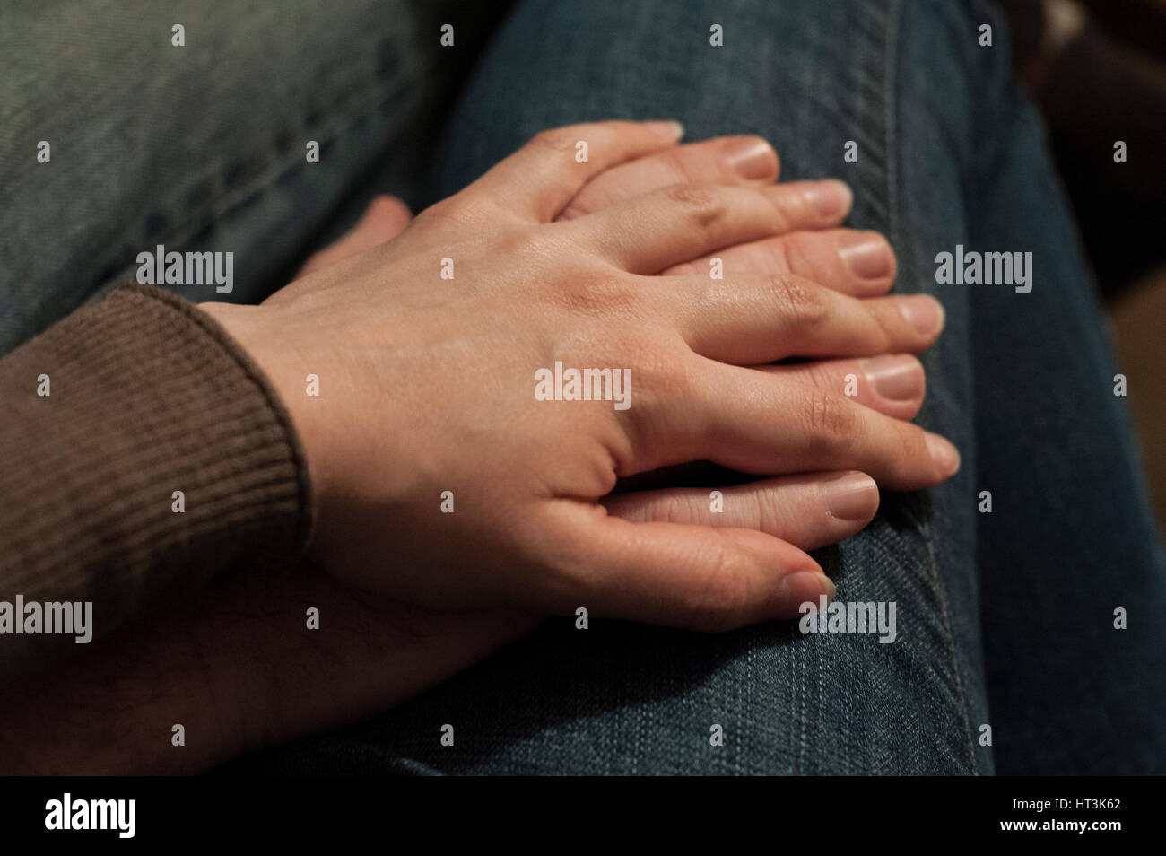 Intertwined fingers hi-res stock photography and images - Alamy