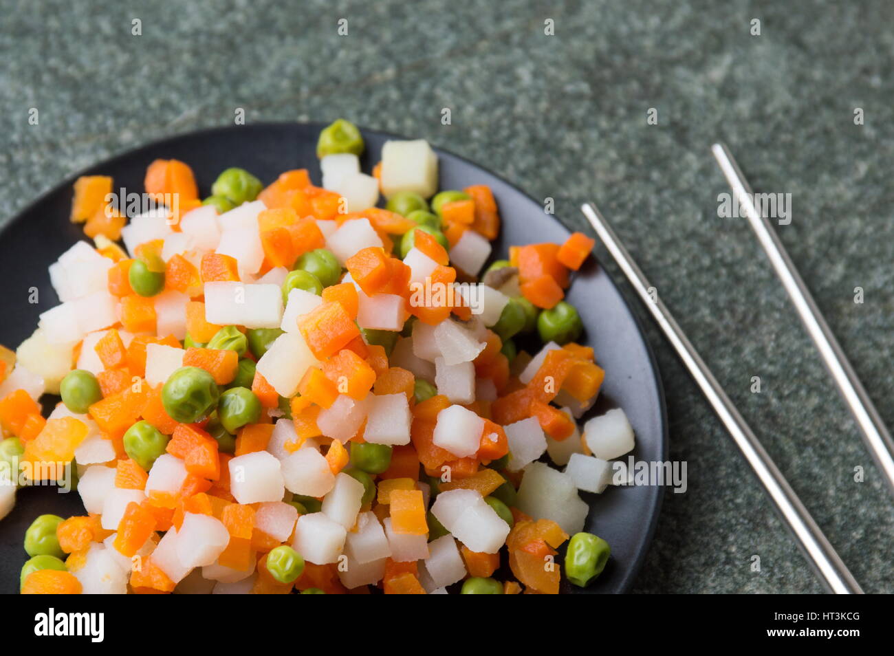 Cooked vegetables on a plate for making salad Stock Photo - Alamy