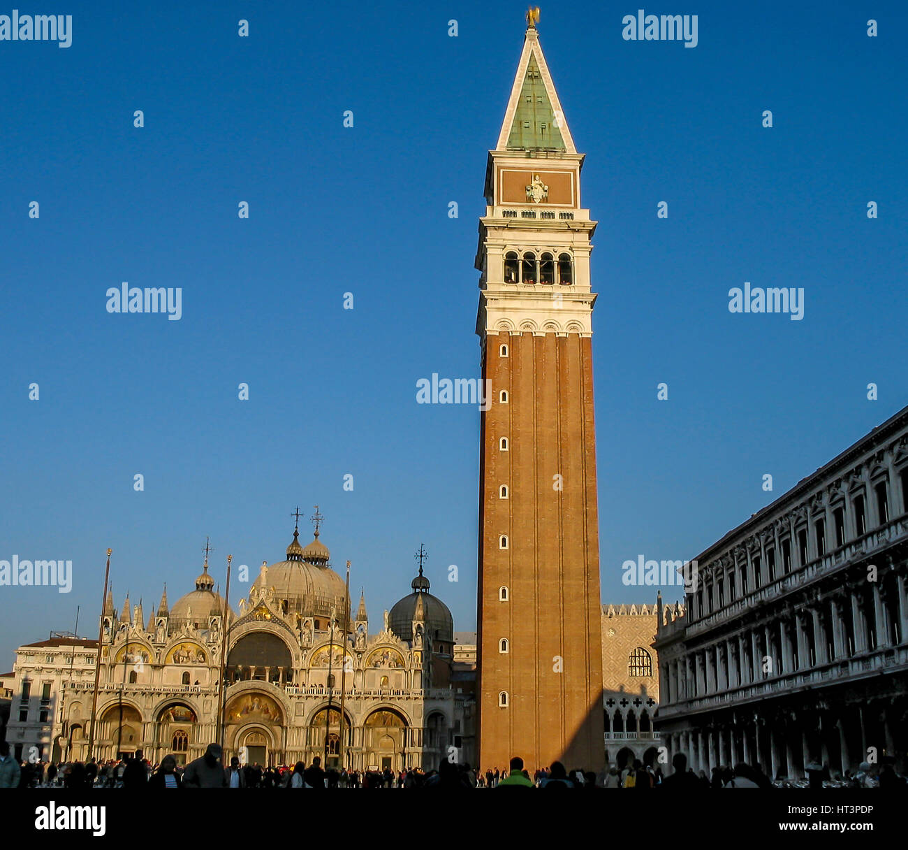 Campanile and Basilica San Marco illuminated by evening light in Venice ...