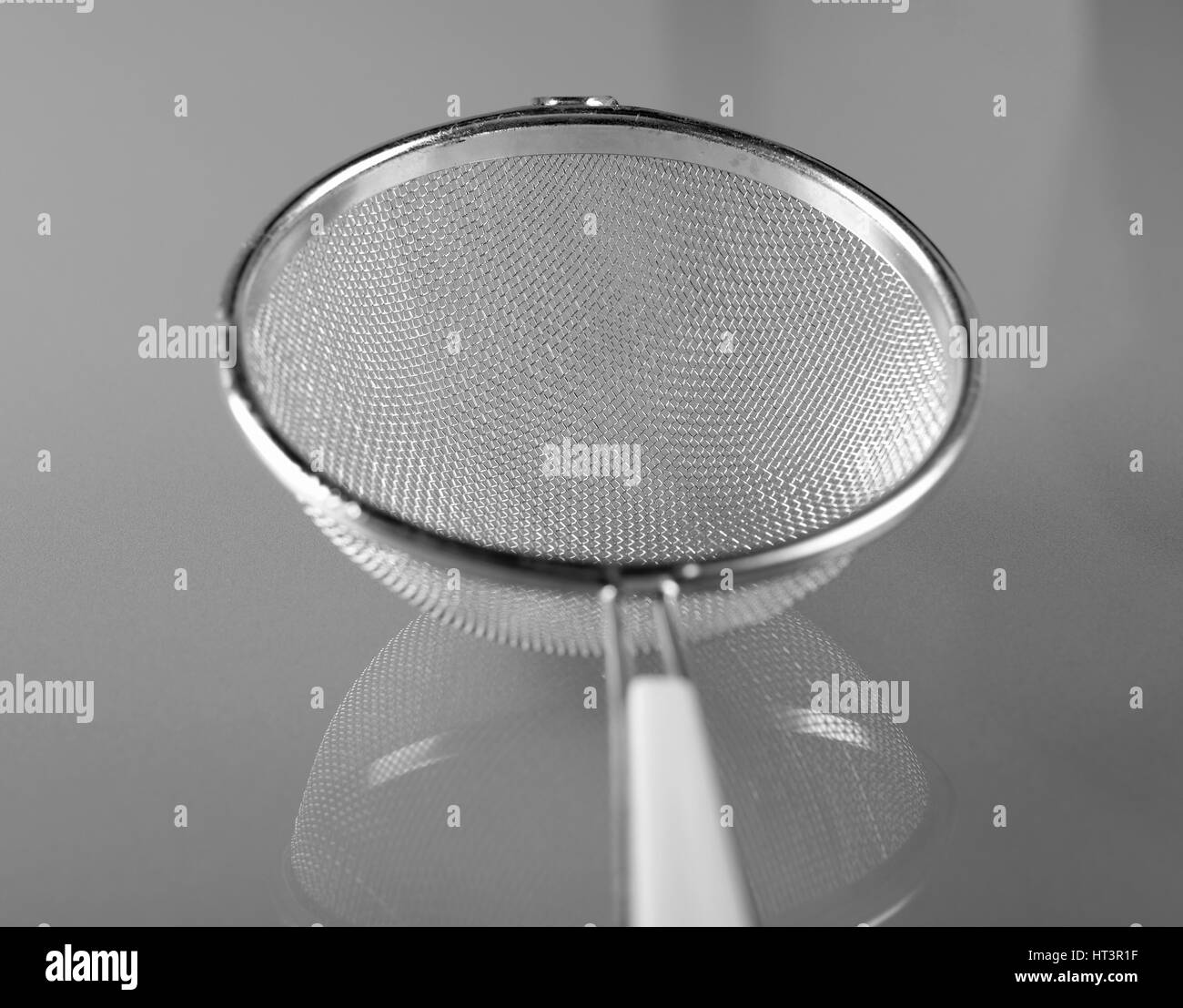 Close up of metallic strainer with plastic handle, a modern kitchen ...