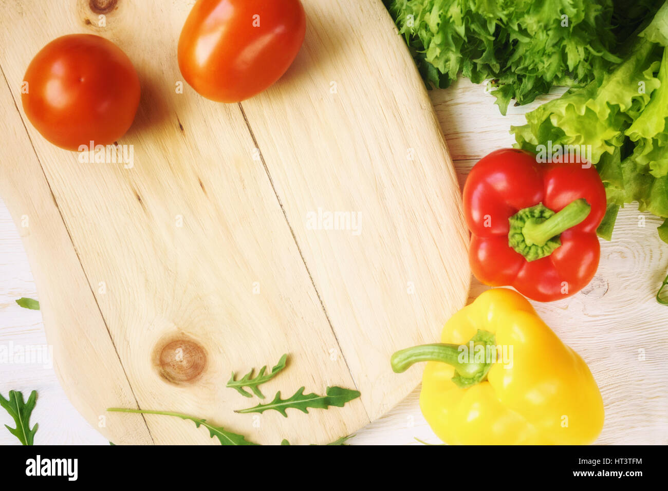 bell pepper, green salad and arugula on white boards, flat lay Stock ...