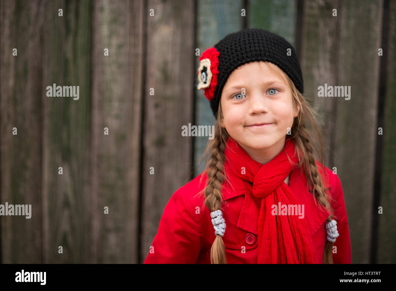 fashion child girl close to rustic wooden fence by evening light Stock ...