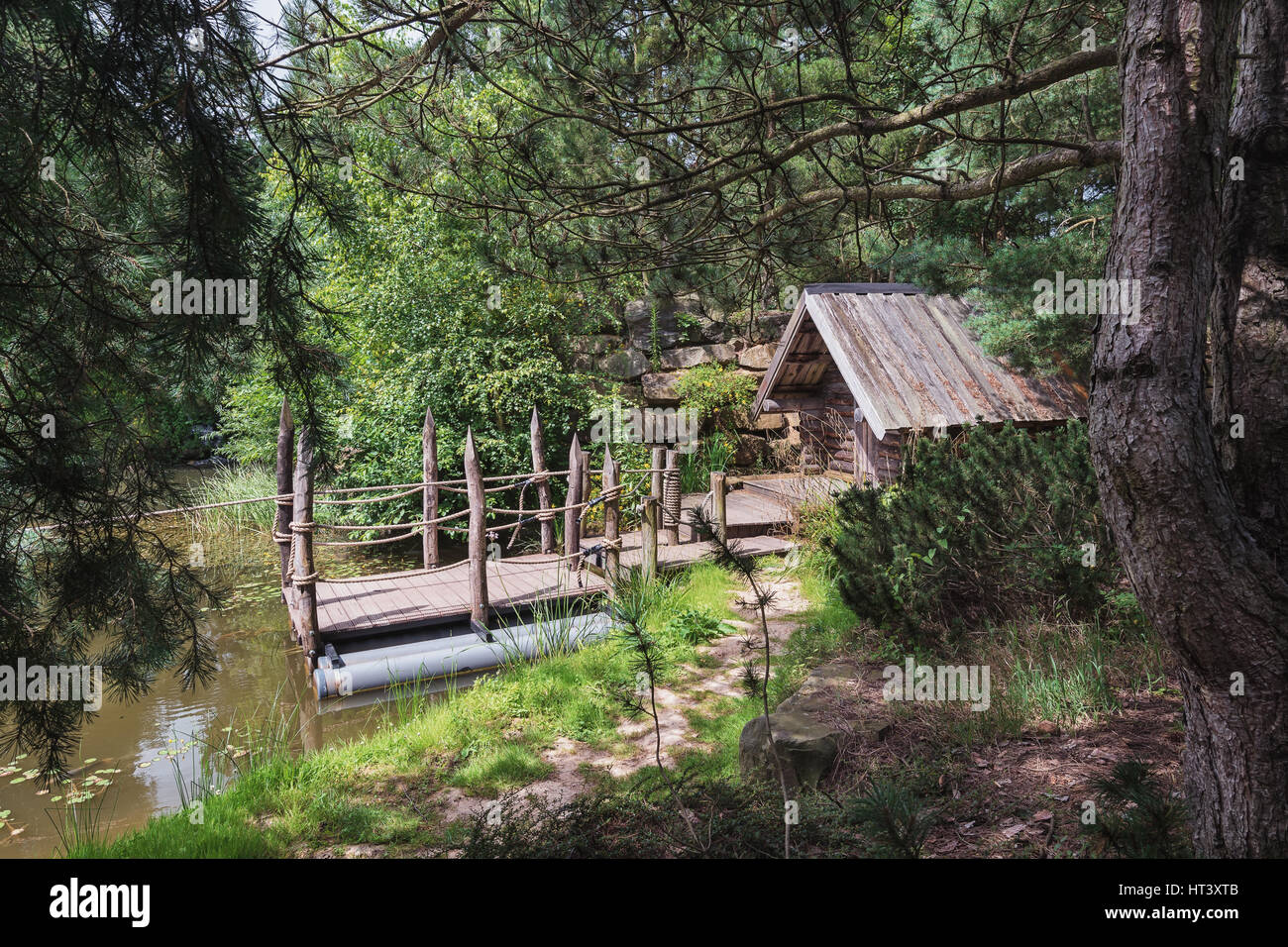 Small timber house with a raft on the shore of the park Mondo Verde ...