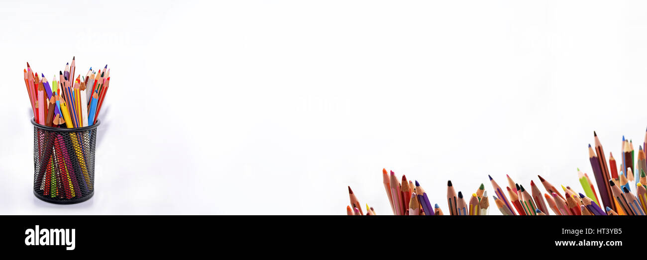 Colored pencils on table. Isolated on white background Stock Photo - Alamy