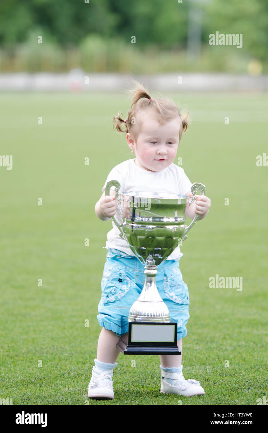 Children holding trophy hi-res stock photography and images - Alamy