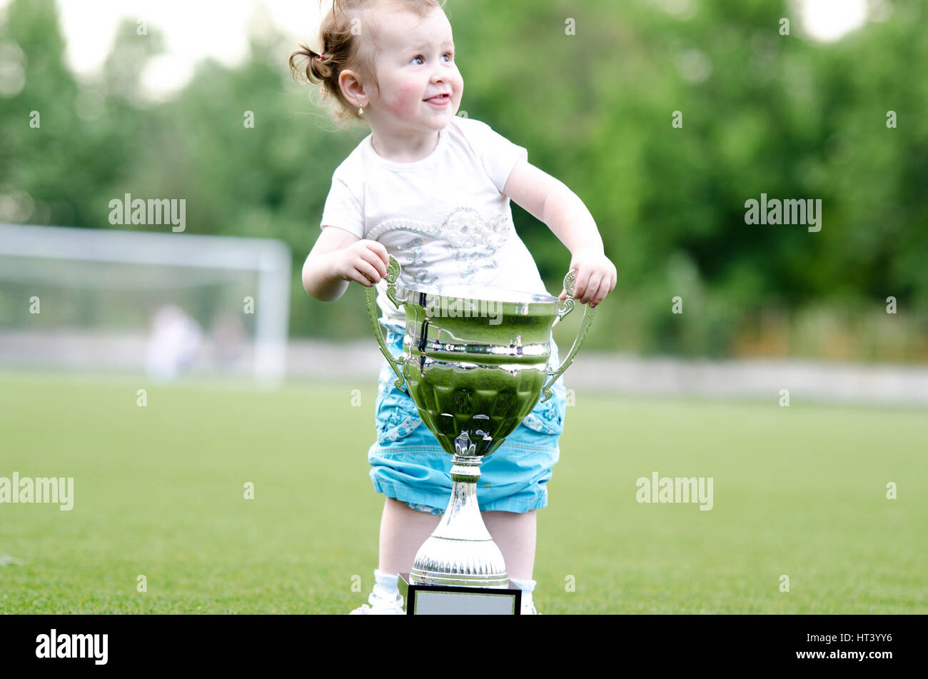 Kid with trophy Stock Photo - Alamy
