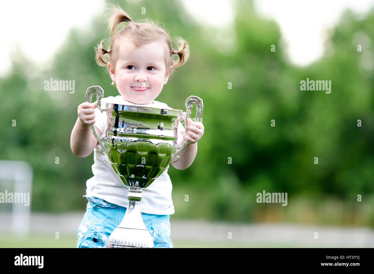 Standing holding smiling trophy achievement hi-res stock photography ...