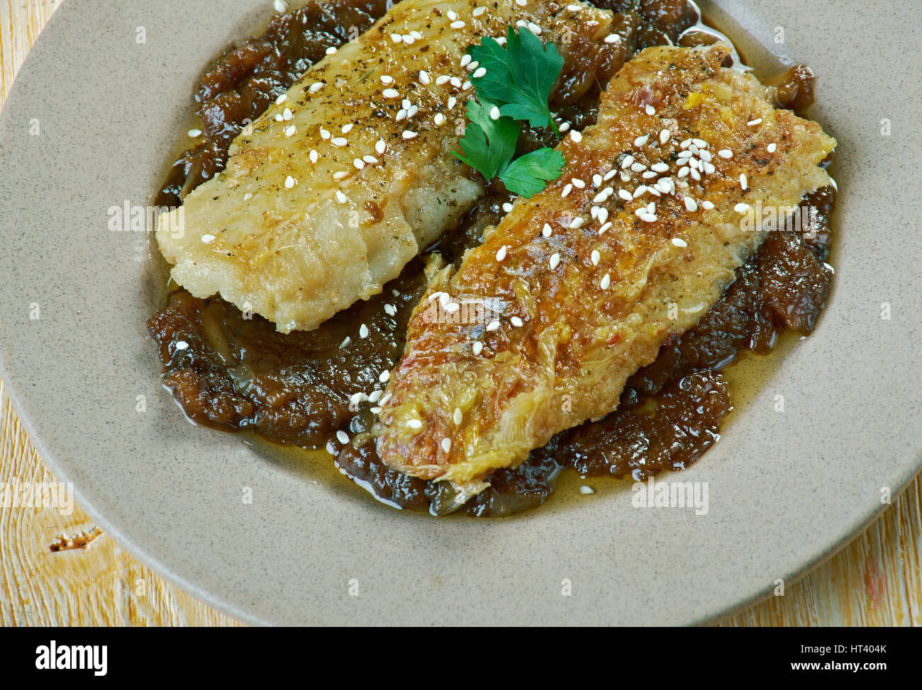 Pan Fried Fish with Kenyan Sweet and Sour Ukwaju Sauce Stock Photo - Alamy