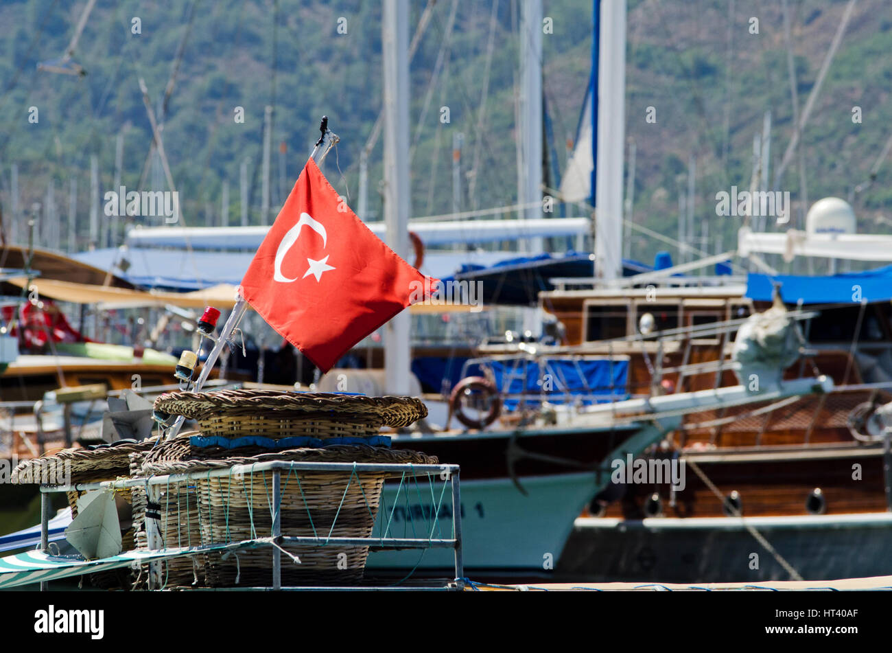 the turkish flag flies from the harbour boats and sailing craft in ...