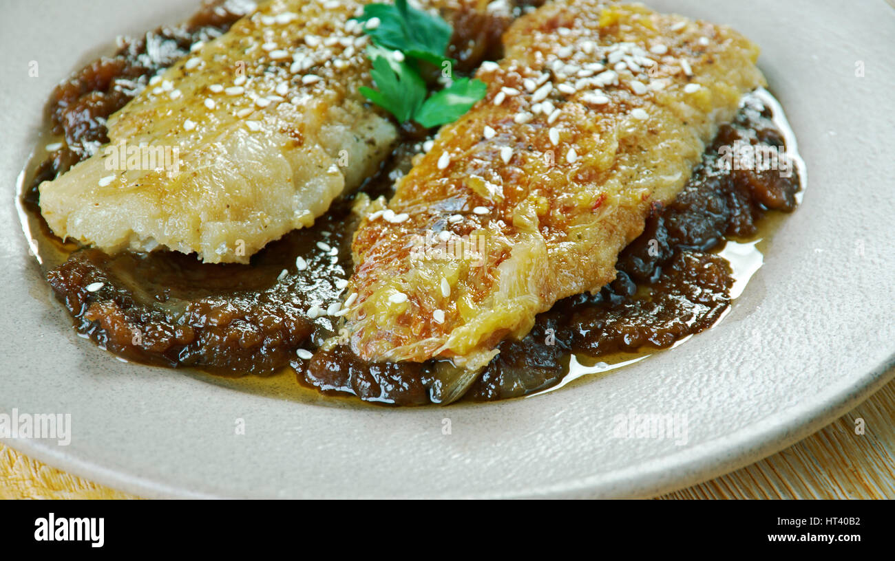 Pan Fried Fish with Kenyan Sweet and Sour Ukwaju Sauce Stock Photo - Alamy