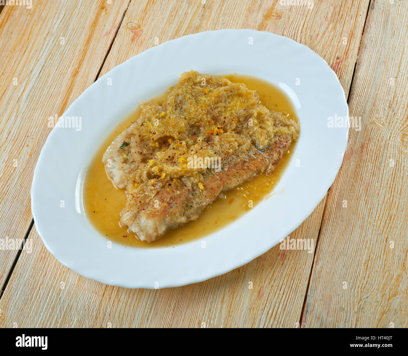 Grilled Monkfish in Orange Sauce Stock Photo - Alamy