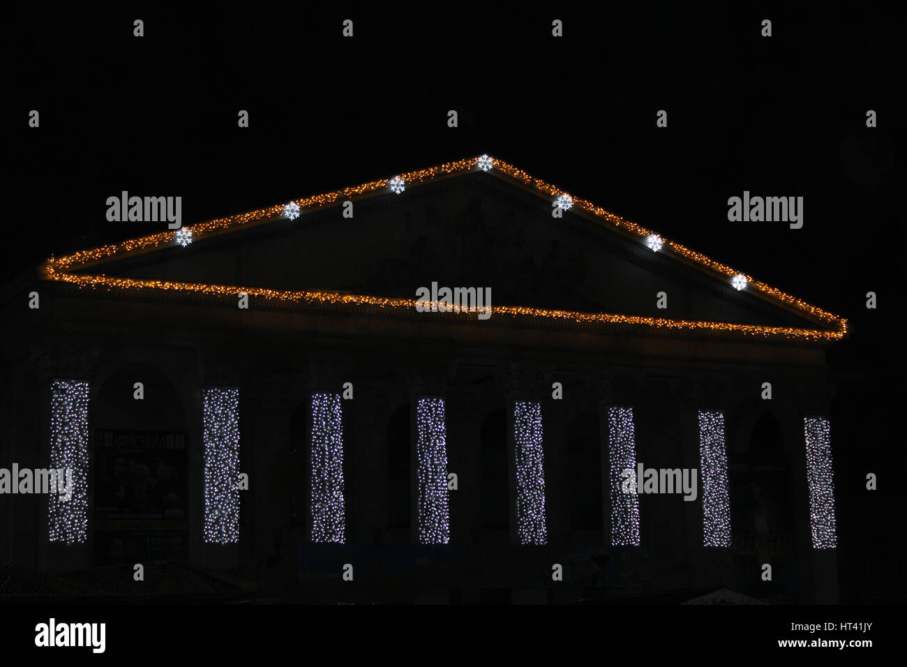 decorated with illuminations from multicolored lights on the building ...