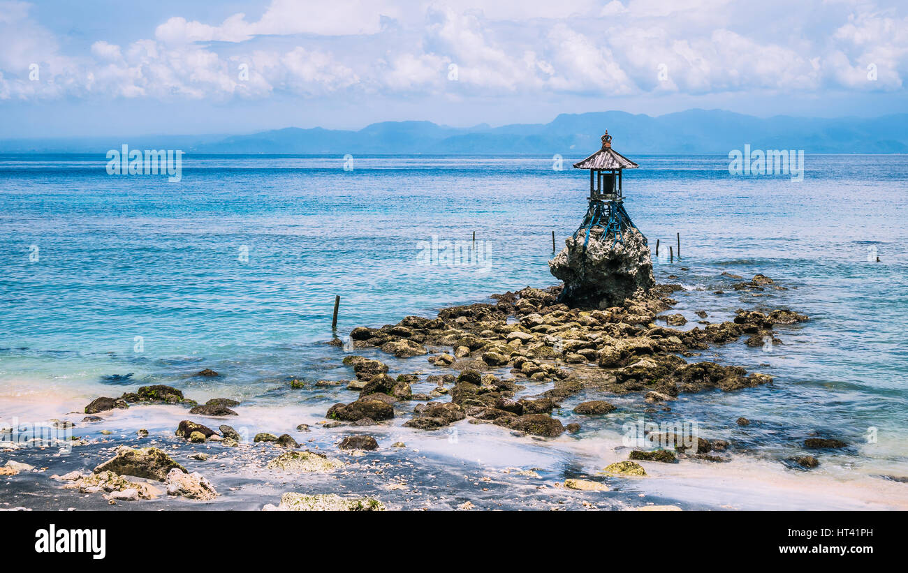 Cute Temple on the Shore by the Sea on Nusa Penida with Dramatic Clouds ...