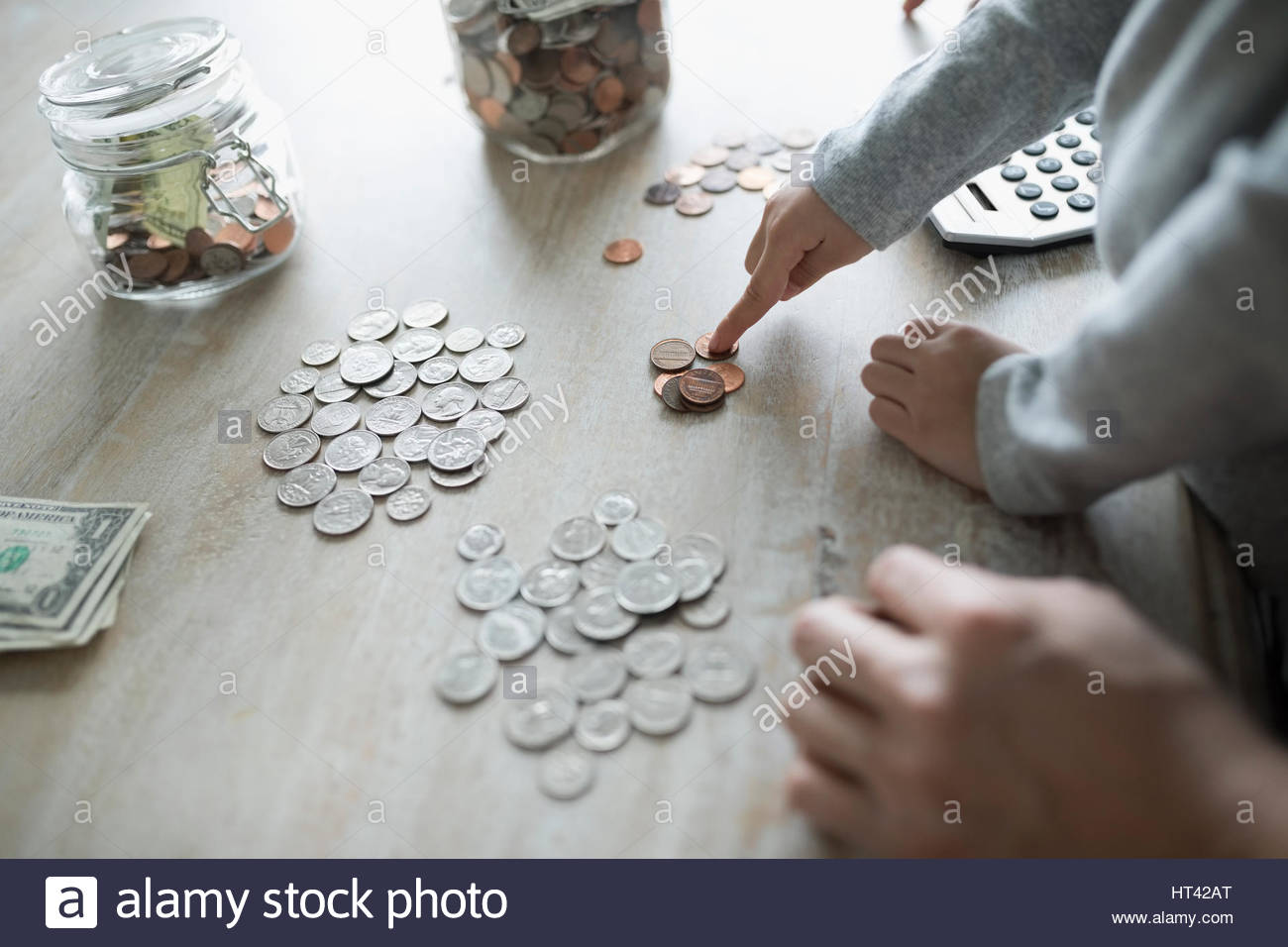 Girl counting allowance money Stock Photo - Alamy