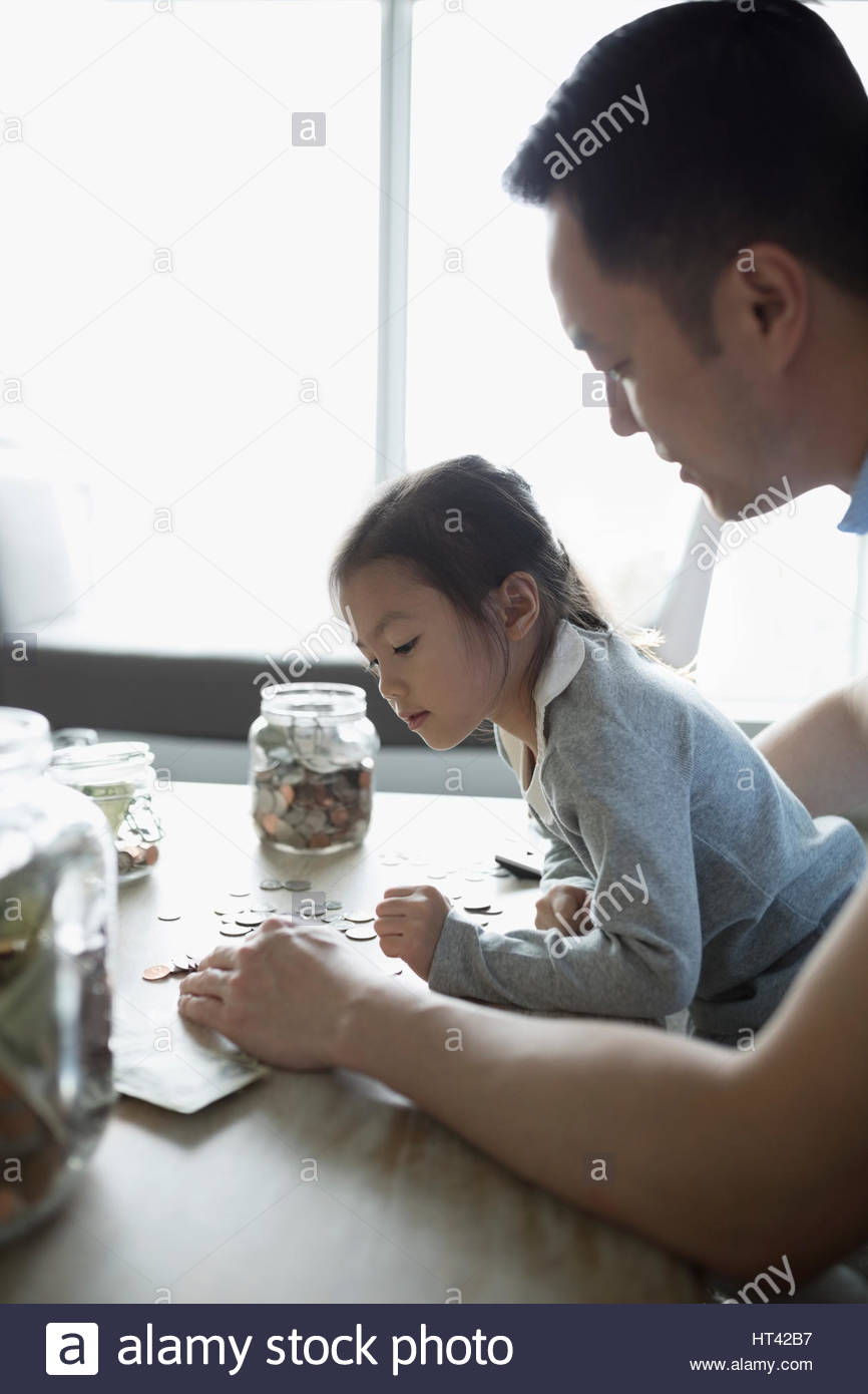 Black family counting cash hi-res stock photography and images - Alamy