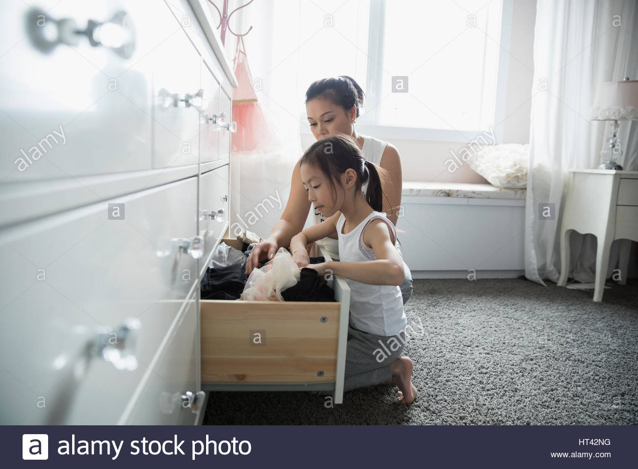 Putting clothing away dresser hi-res stock photography and images - Alamy
