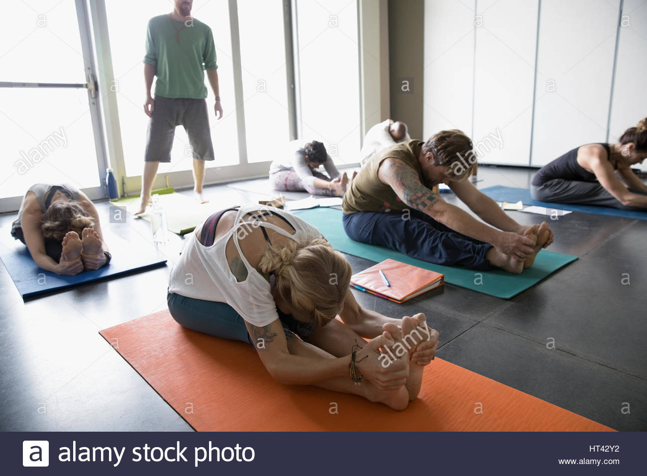 Seated forward fold yoga hi-res stock photography and images - Alamy