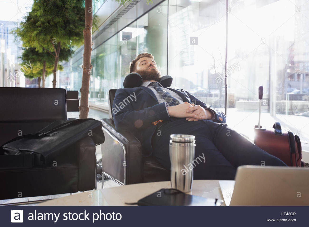 Businessman sleeping airport hi-res stock photography and images - Alamy