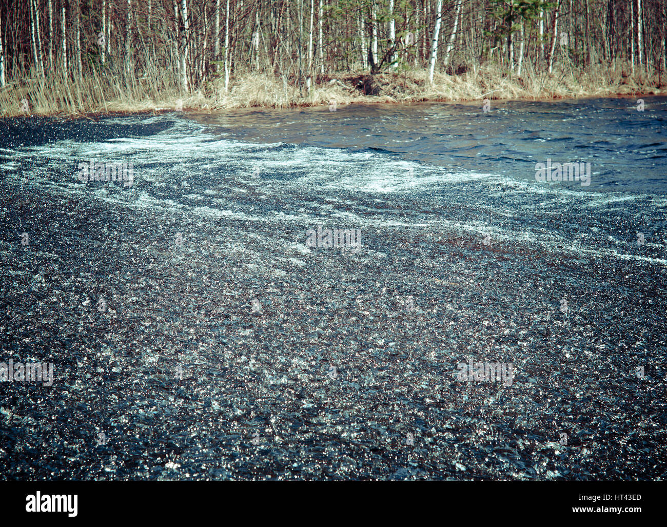 Russian Spring landscape with flooded.icy slush on the water of the ...