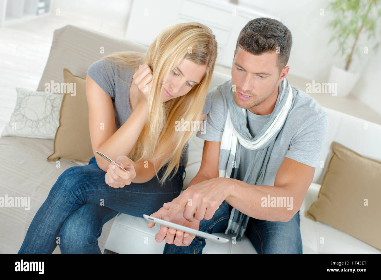 showing something in the tablet Stock Photo - Alamy