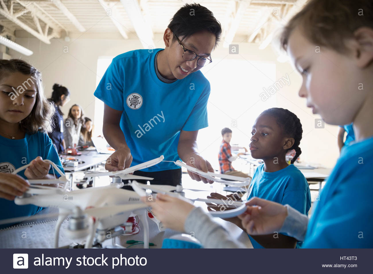 Teacher helping students robotics hi-res stock photography and images ...