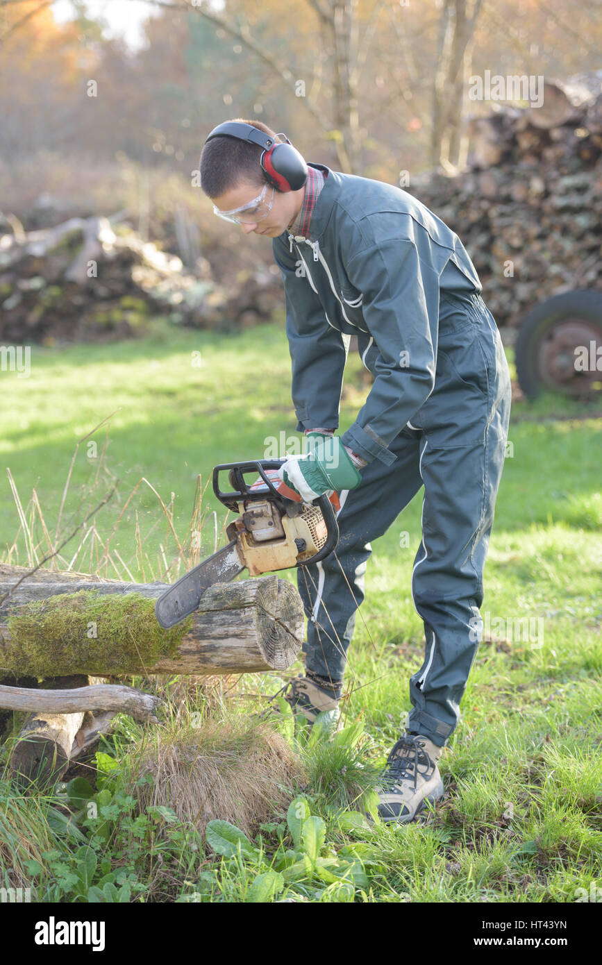 Man using chainsaw hi-res stock photography and images - Alamy