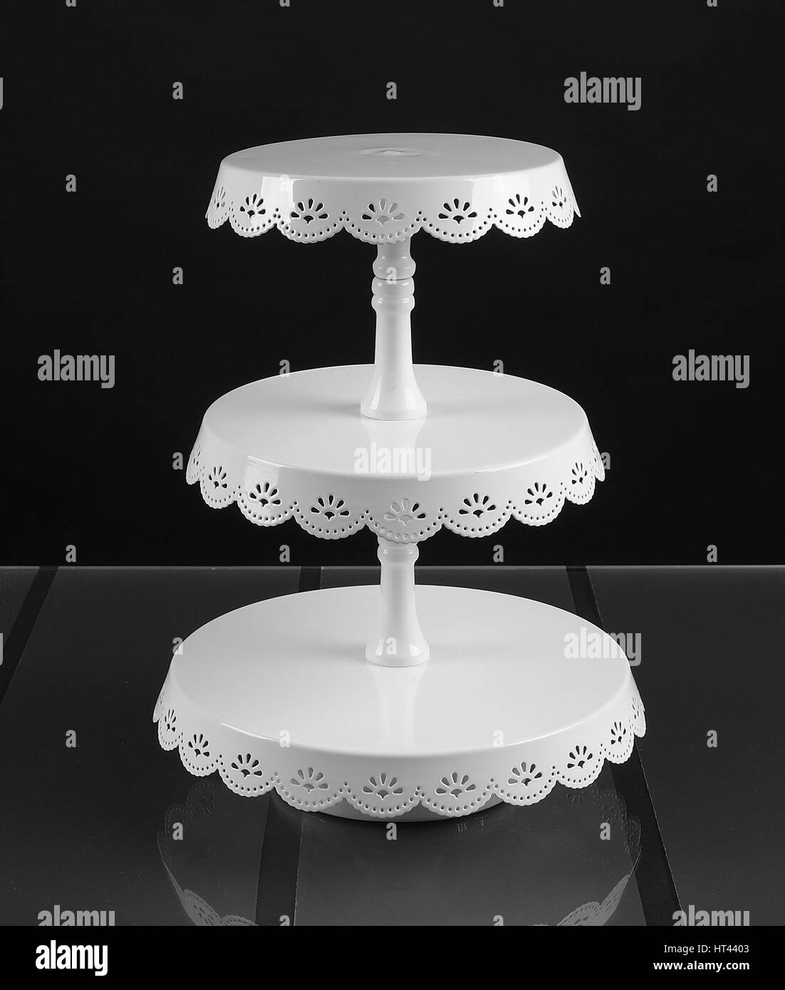 Empty white metal stand for delicious dessert and cake Stock Photo - Alamy