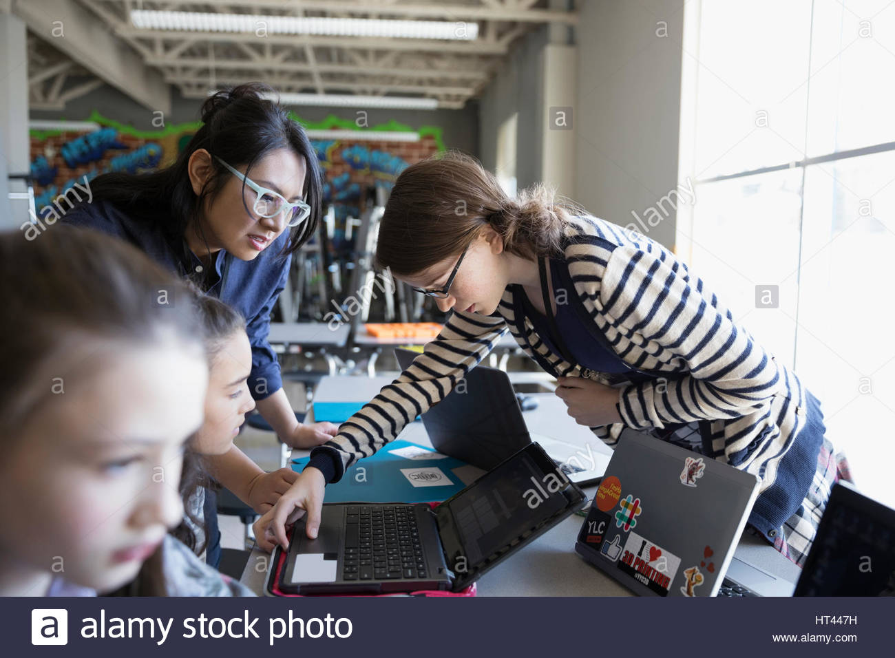 Girls sharing laptop classroom hi-res stock photography and images - Alamy
