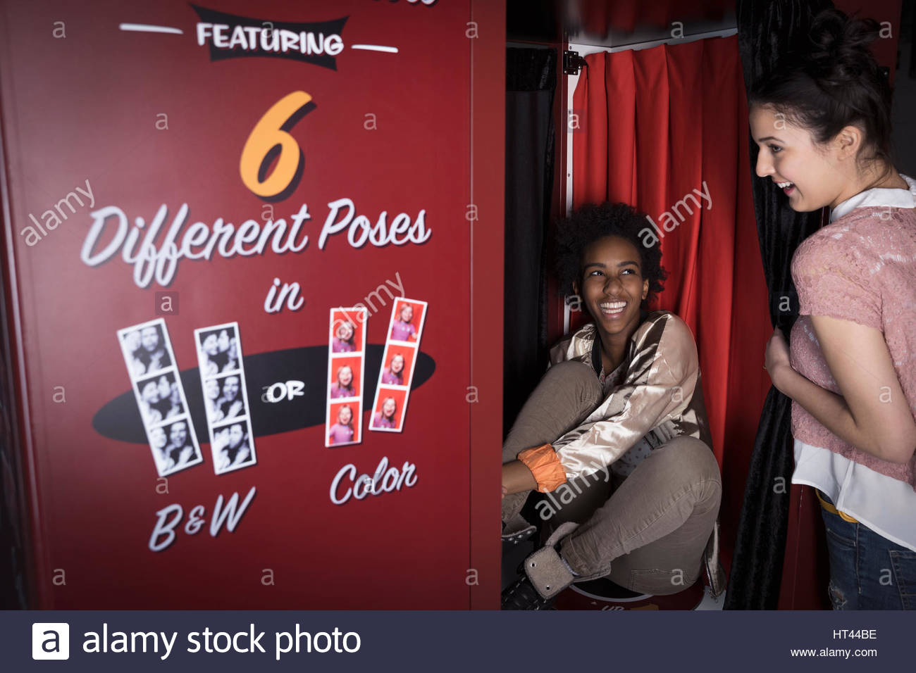 Two young people standing photo booth hi-res stock photography and ...