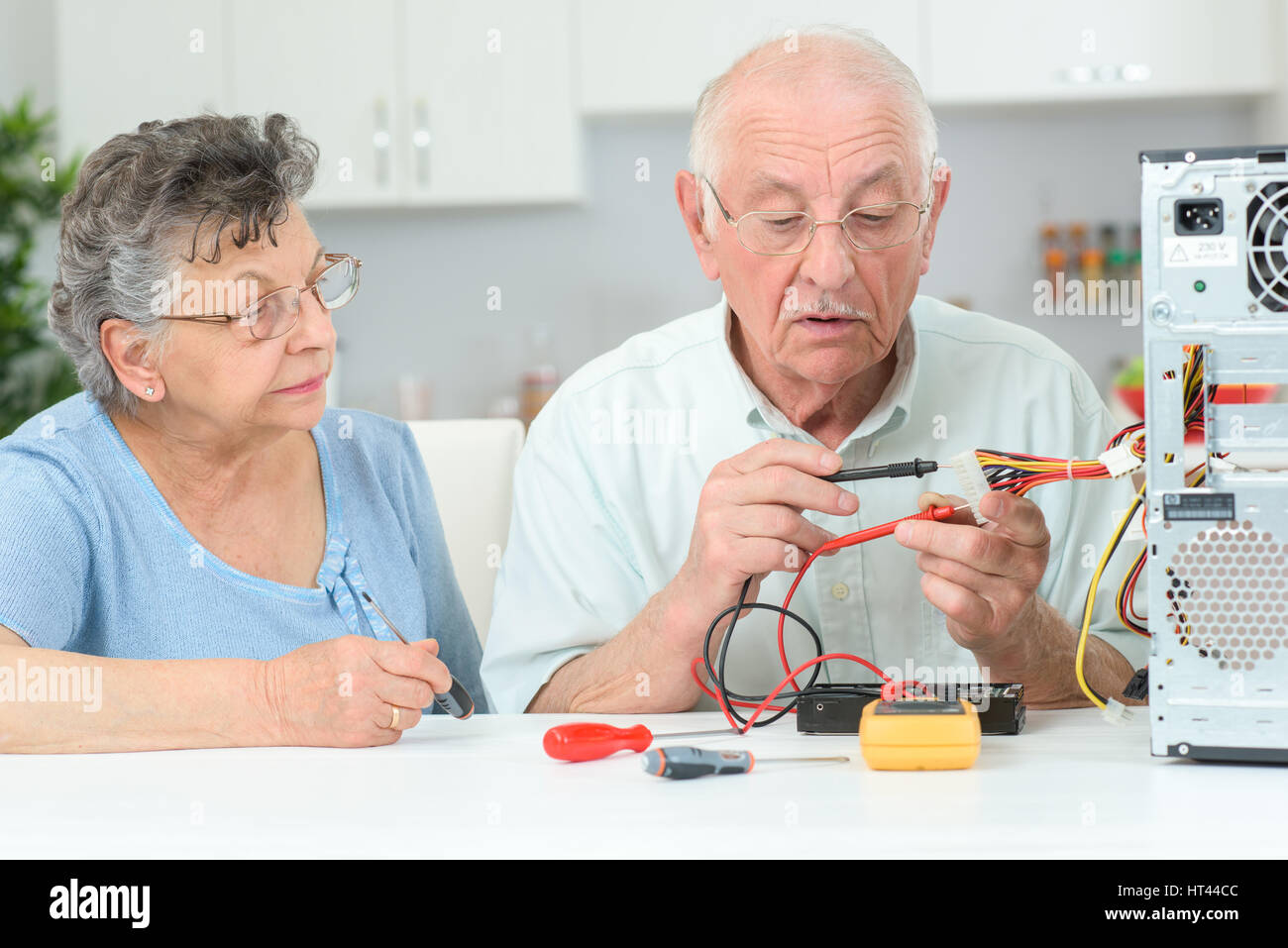 elderly man fixing a cpu Stock Photo - Alamy