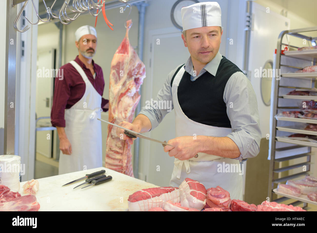 Butcher uniform sharpening knife hi-res stock photography and images ...