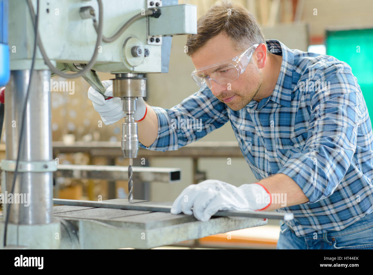 Man drilling hole factory hi-res stock photography and images - Alamy