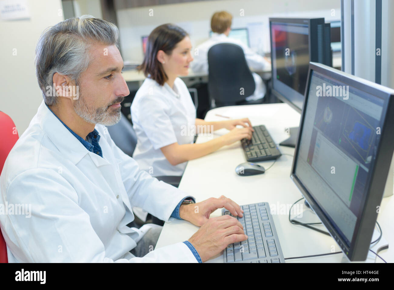 Male laboratory worker using computer Stock Photo - Alamy