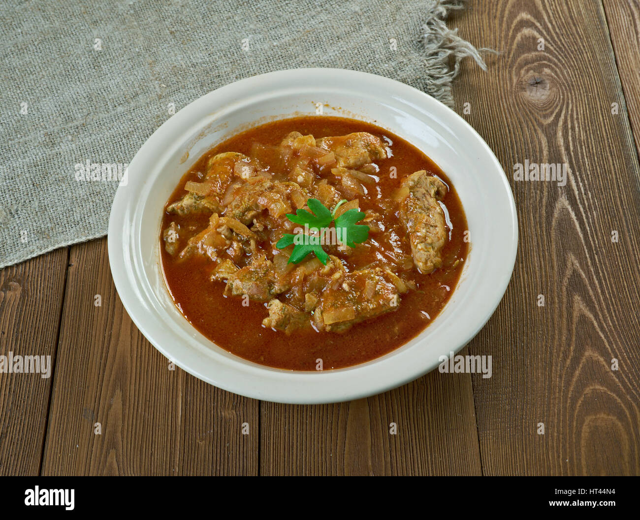 Sarapatel - Goan cuisine. pork steamed coconut bread Stock Photo - Alamy