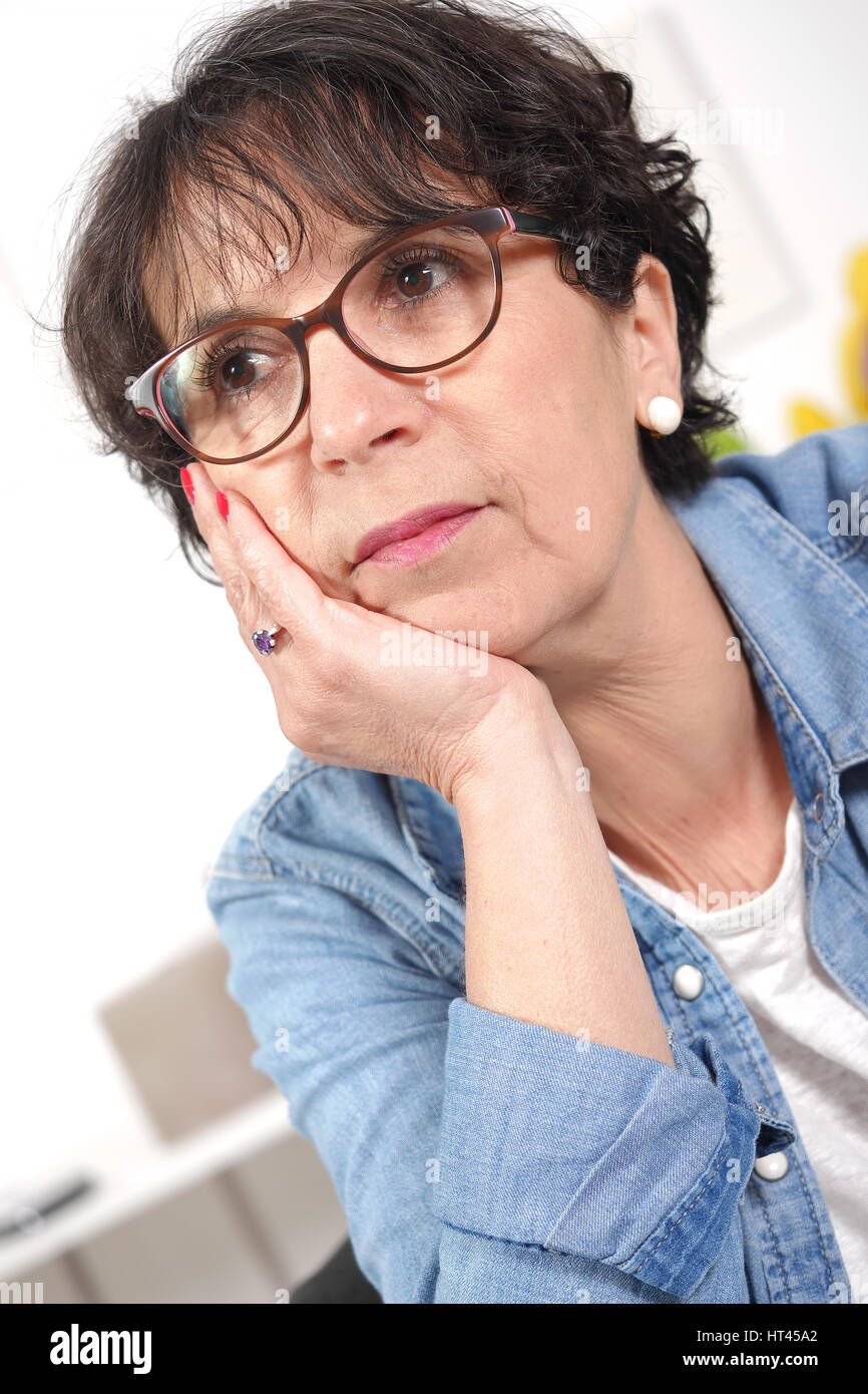 portrait of a brunette mature woman with glasses Stock Photo - Alamy