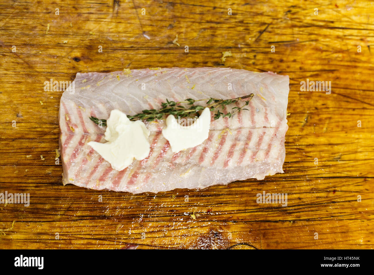 raw fish sturgeon cooking by professional on wooden desk Stock Photo ...