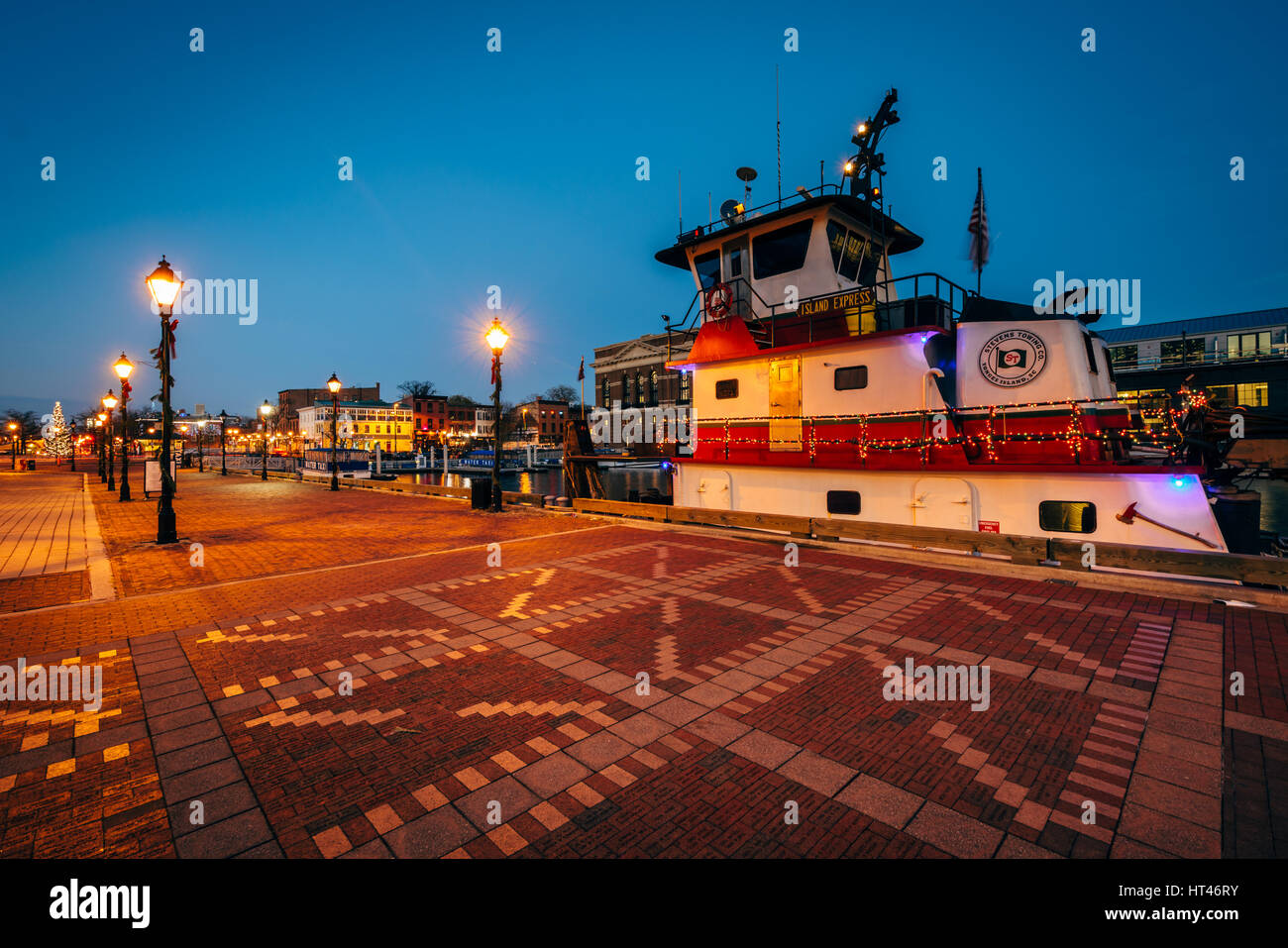 Boat docked along Broadway Pier at night in Fells Point, Baltimore ...